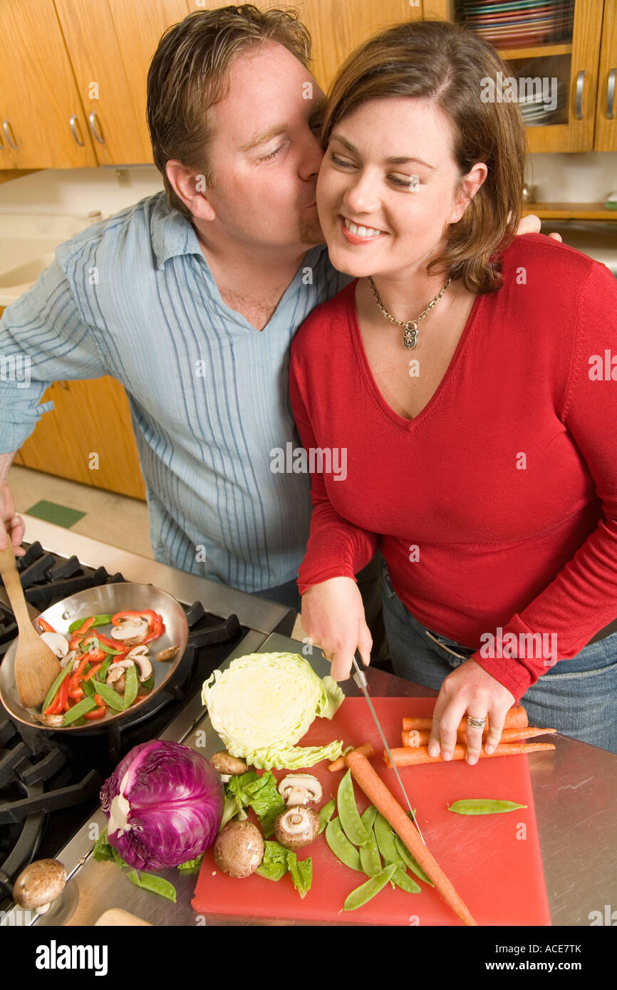Couple cooking together Stock Photo - Alamy