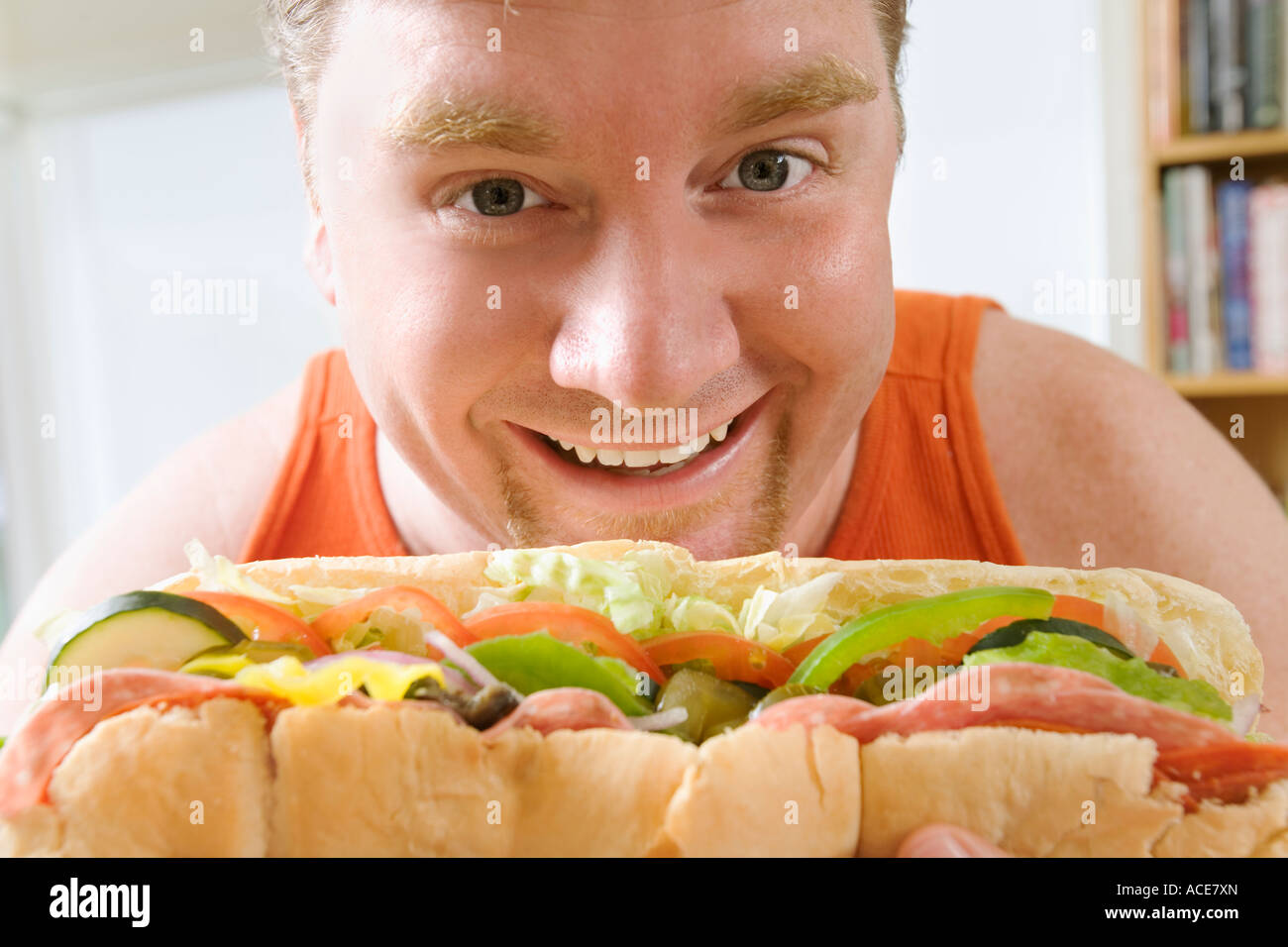 Man holding a big hoagie sandwich Stock Photo - Alamy