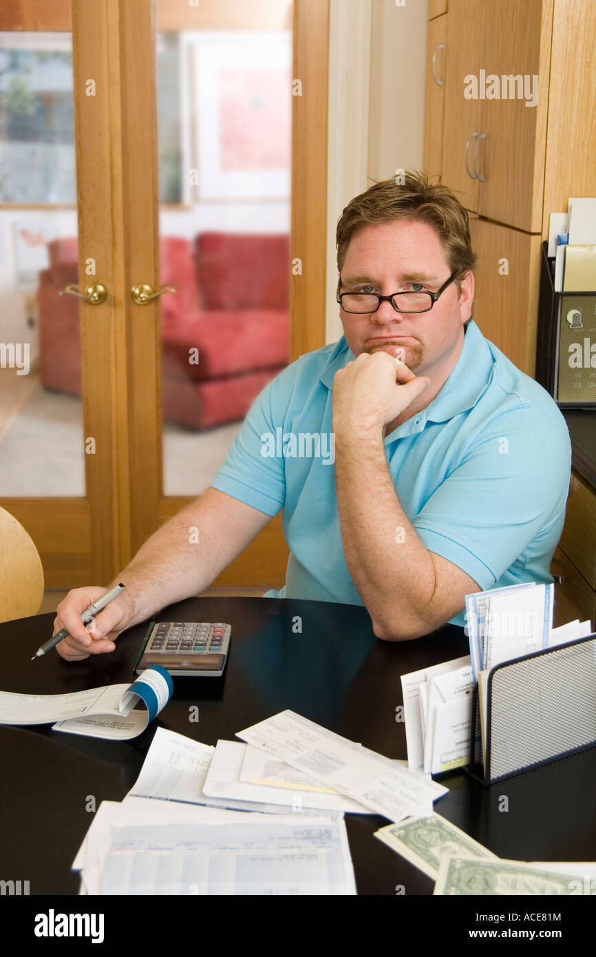 Man paying bills Stock Photo - Alamy