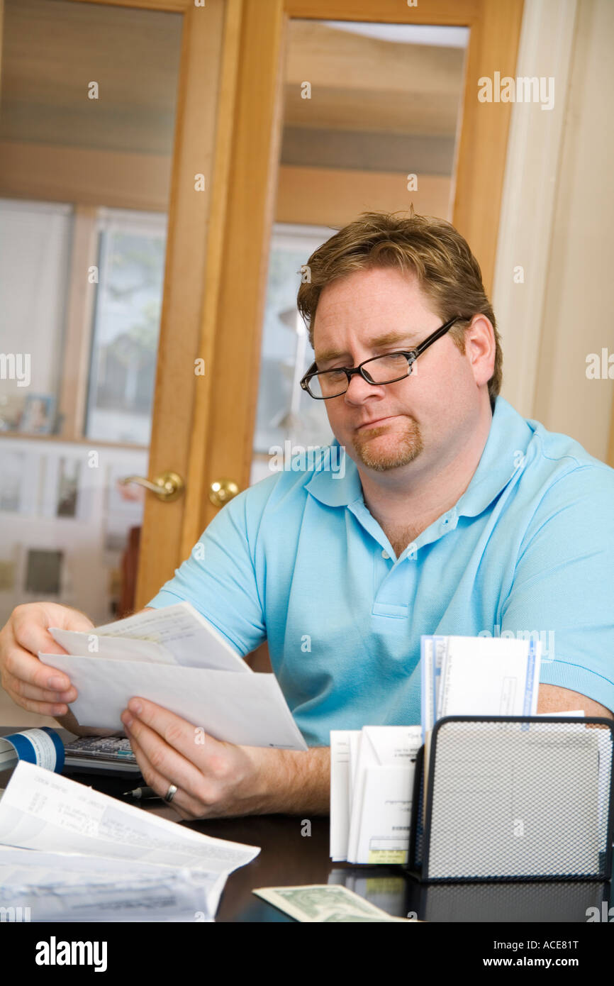 Man reading mail Stock Photo - Alamy