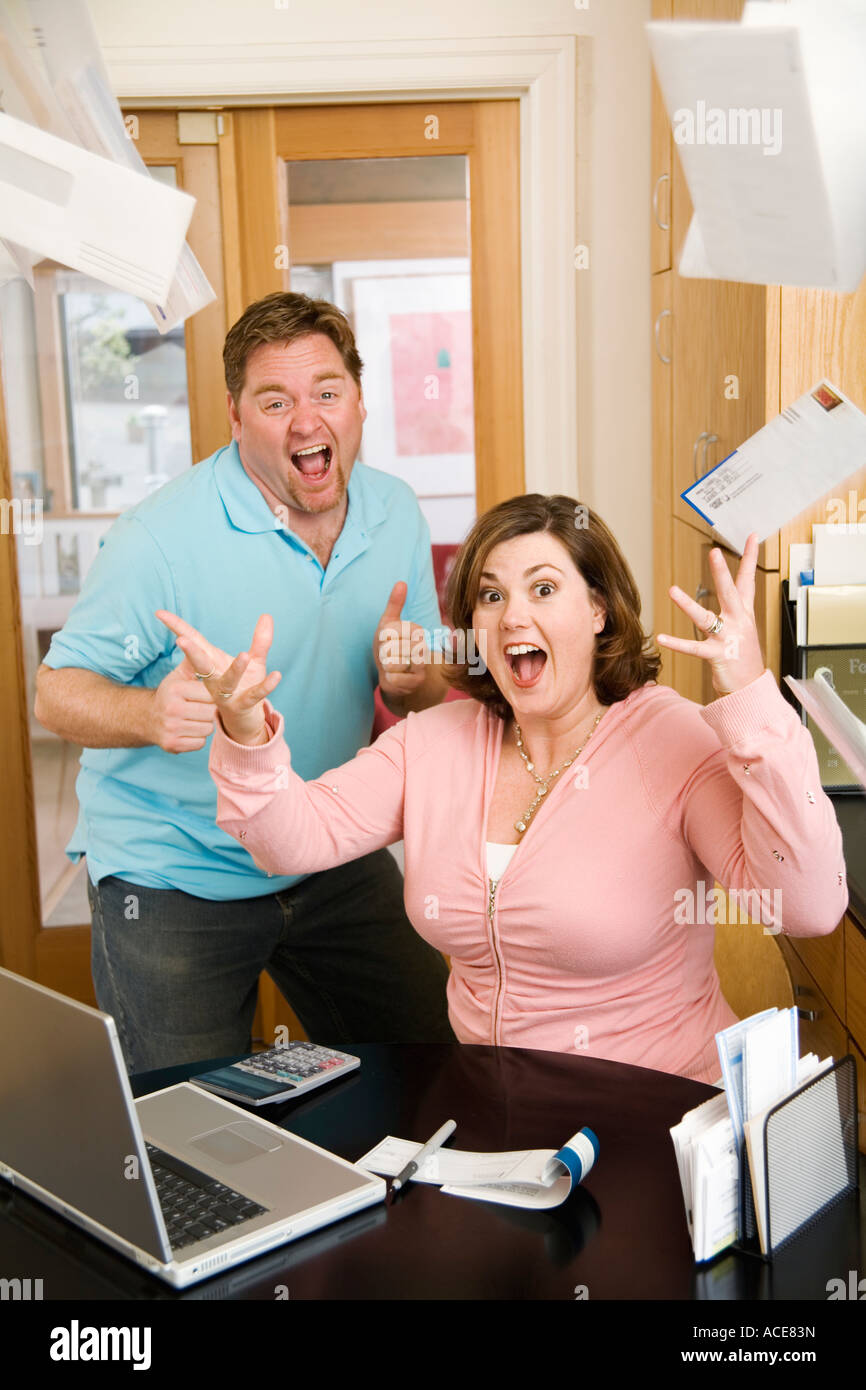 Couple throwing bills in the air Stock Photo - Alamy