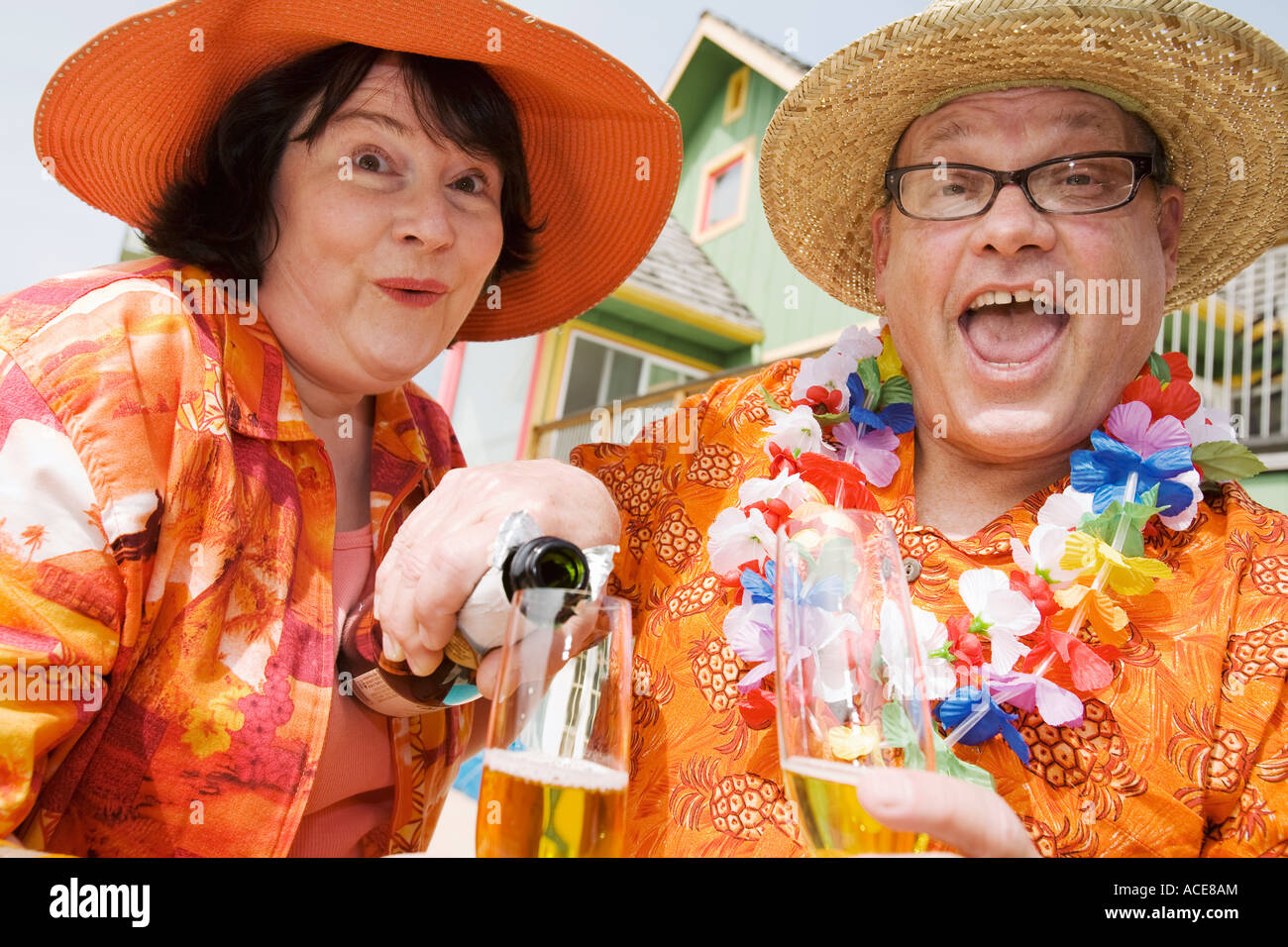 Couple wearing festive outfits Stock Photo - Alamy