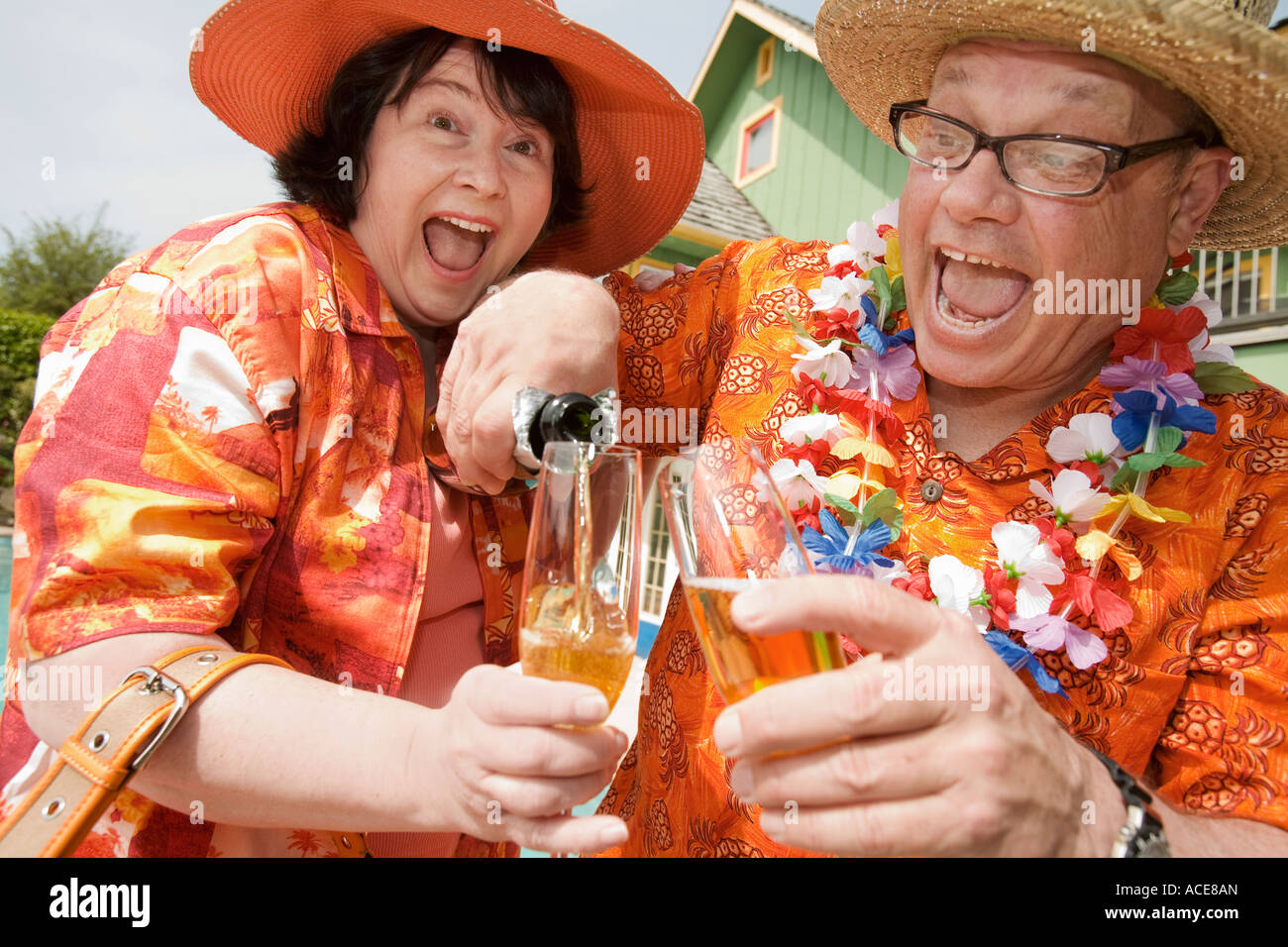 Couple wearing festive outfits Stock Photo - Alamy