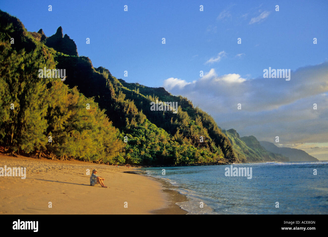 Tourist at Kee Beach on Kauai at sunset Stock Photo - Alamy