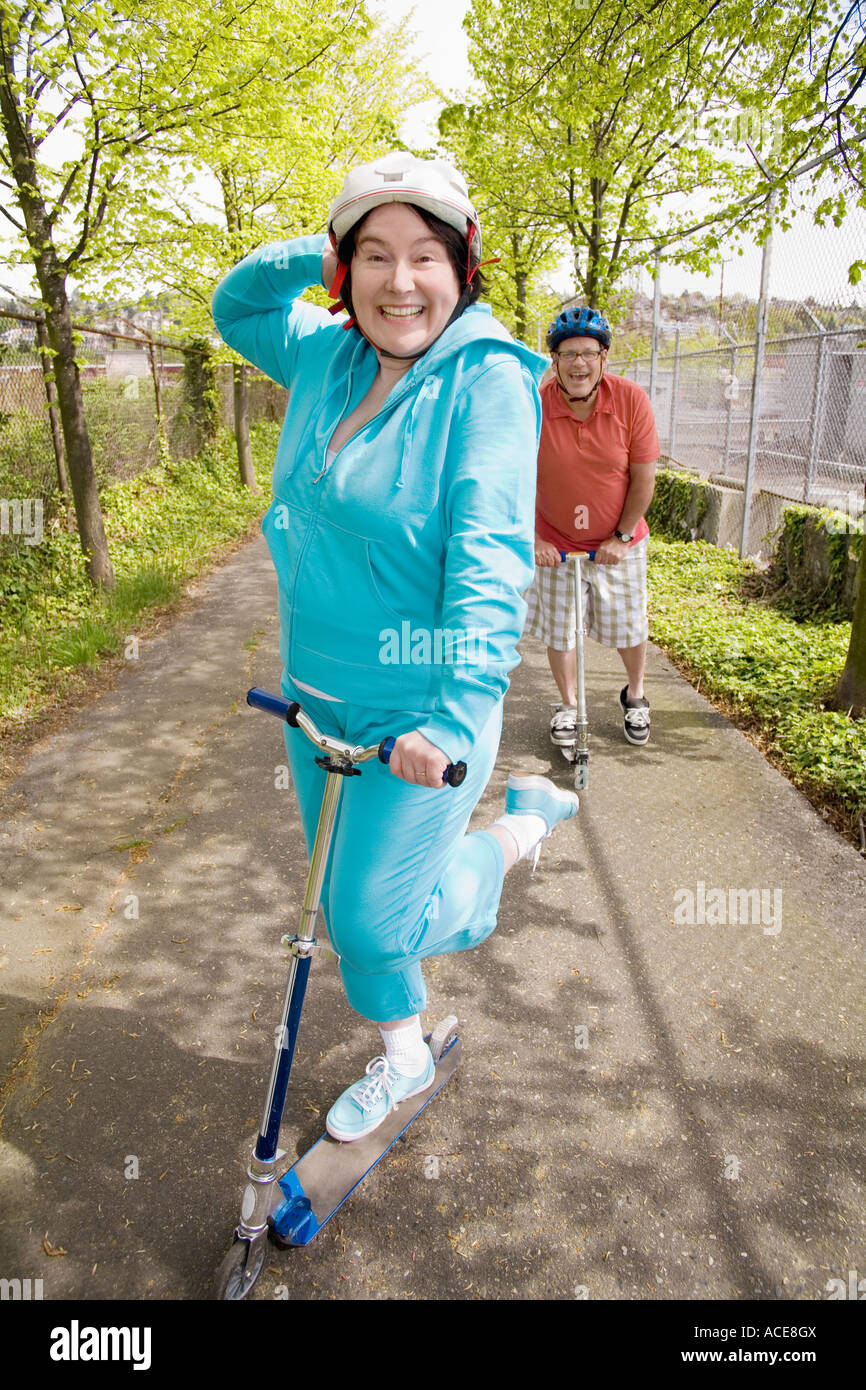 Woman riding a scooter Stock Photo - Alamy