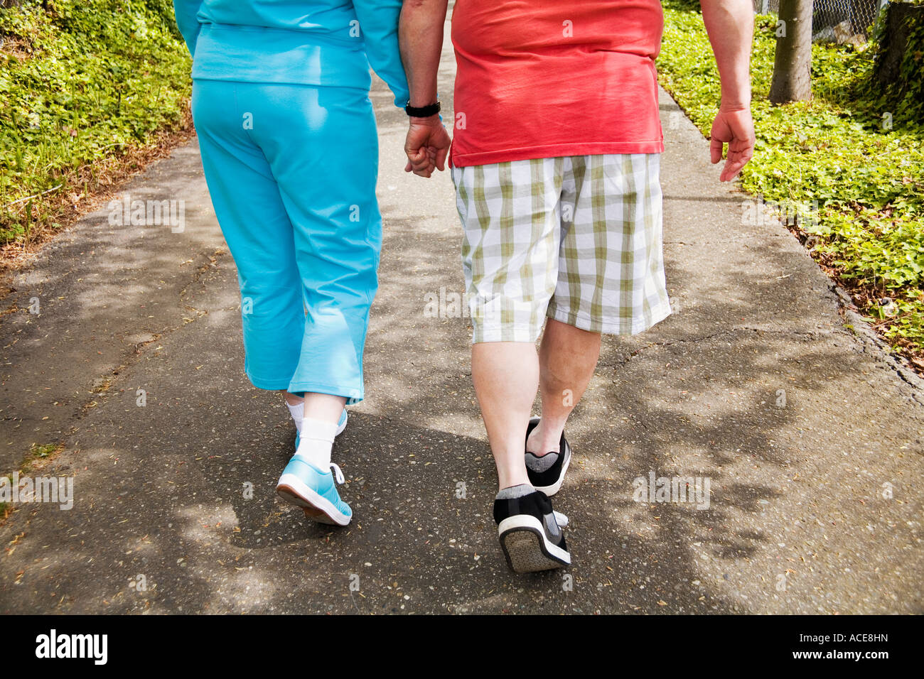 Couple walking together outside Stock Photo - Alamy