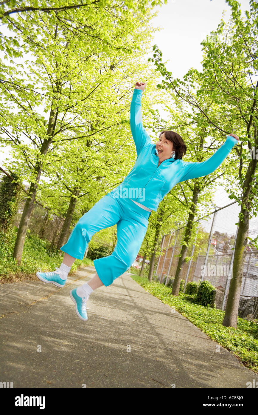 Woman jumping outside Stock Photo - Alamy
