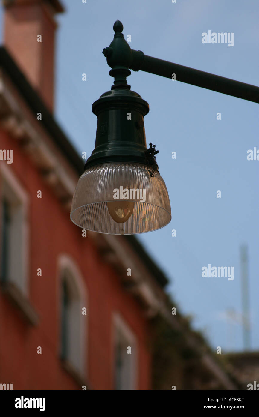 Venice,Italy street lamp detail in sunlight with old building in the ...
