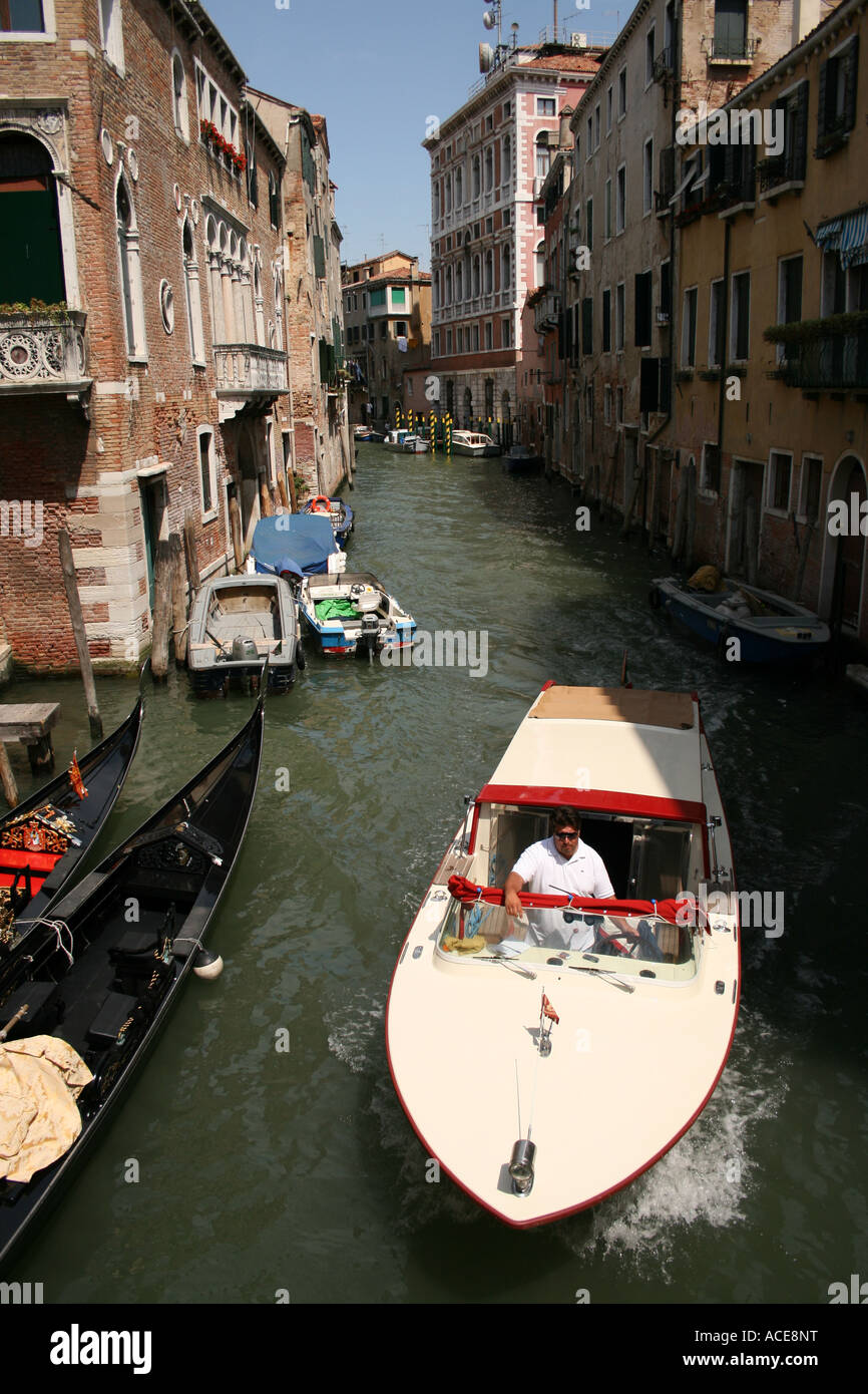 Venice,Italy,side canal on sunny day white speed boat Stock Photo - Alamy
