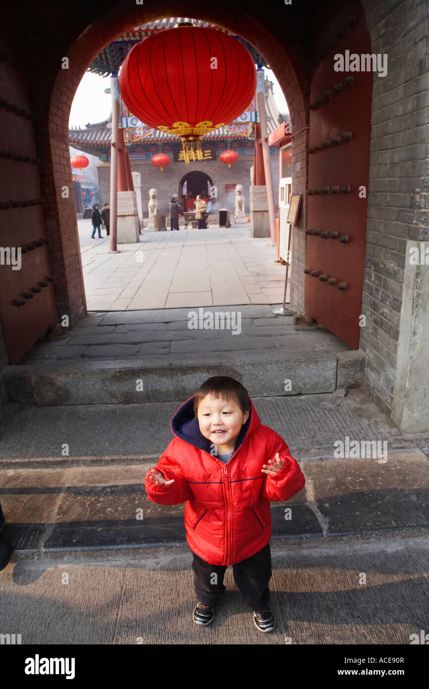 Chinese boy standing in archway, Tianjin, China Stock Photo - Alamy