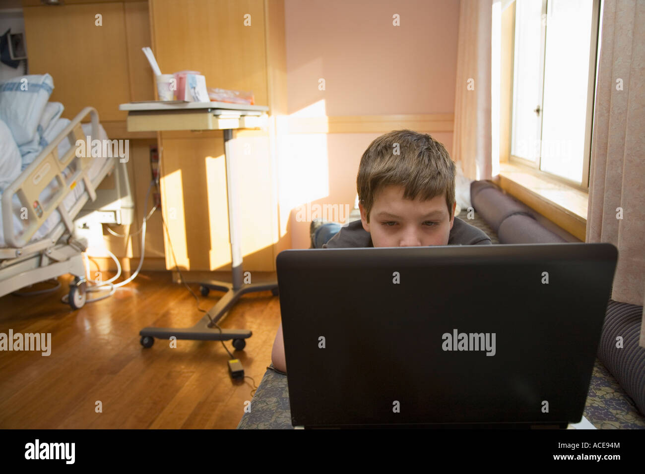 Boy operating laptop hi-res stock photography and images - Alamy