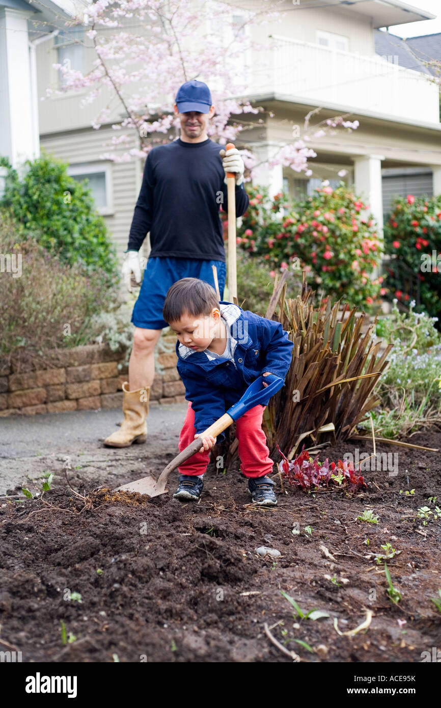 Father and son gardening Stock Photo - Alamy