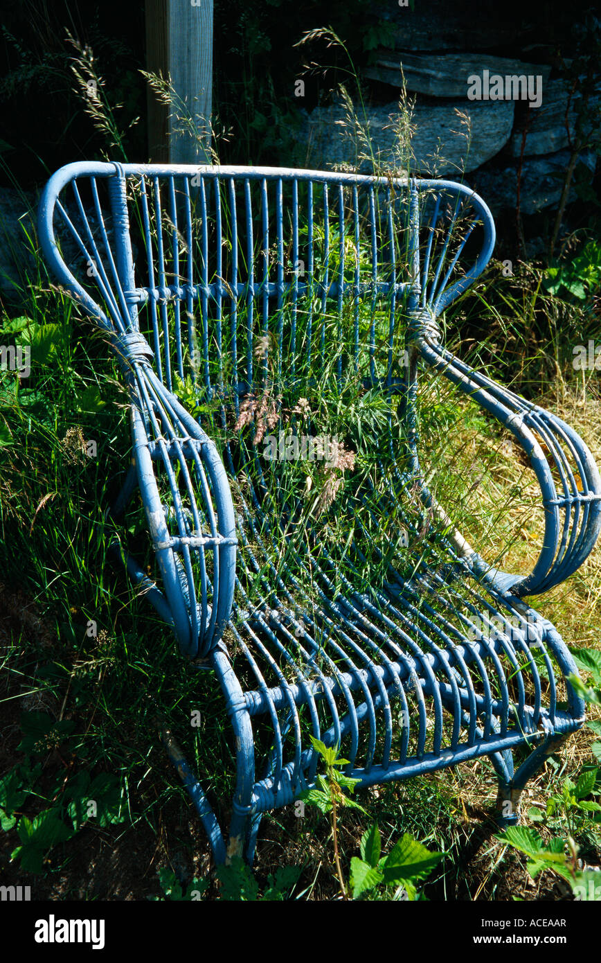 An overgrown outdoor chair Stock Photo - Alamy