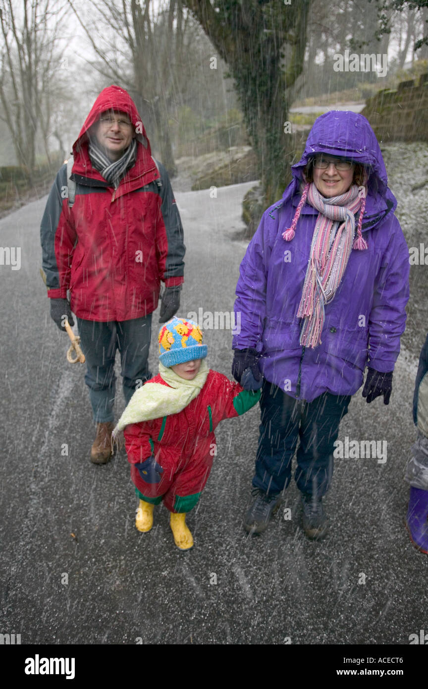a family out walking caught in a hail storm, Ilkley, West yorkshire, UK ...
