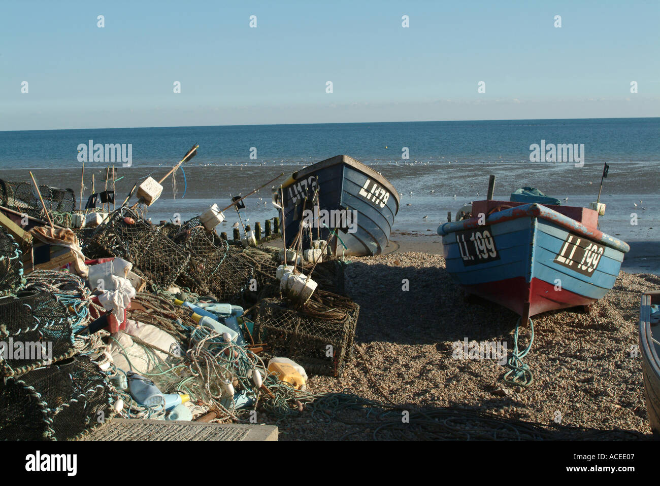 Blue Fishing Boats and Lobster Pots on Beach near Promenade at Bognor ...