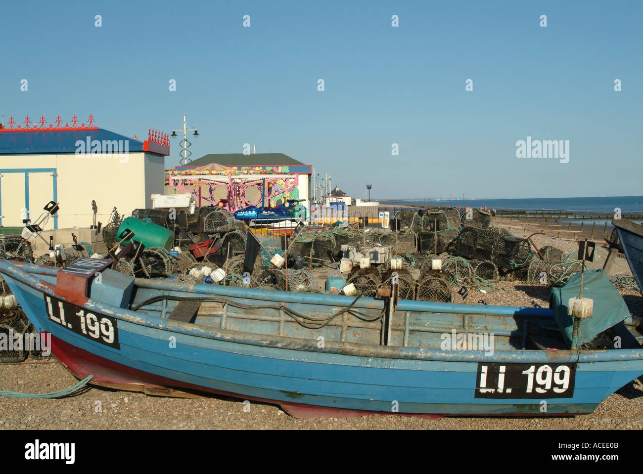 Blue Fishing Boat and Lobster Pots on Beach near Promenade at Bognor ...