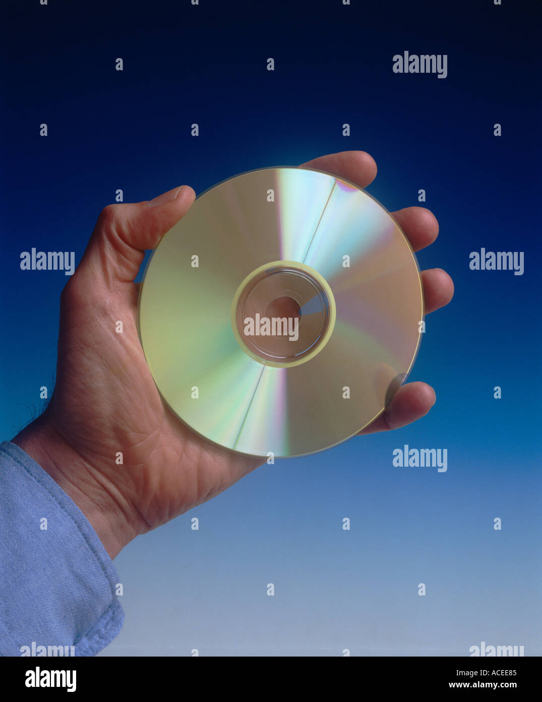 Hand holding a compact disc Stock Photo - Alamy