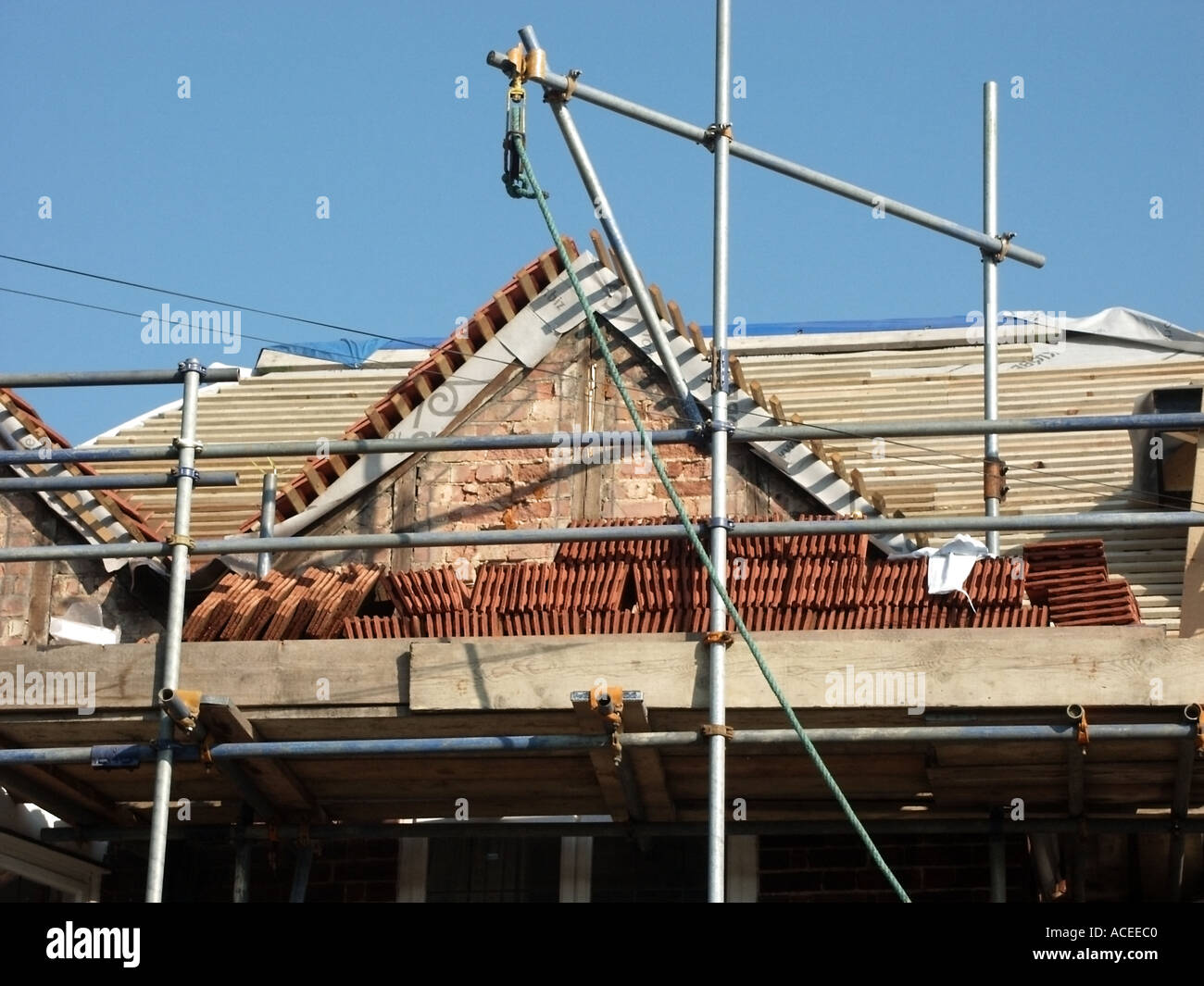 Essex scaffolding and hoist in position during reroofing of existing ...
