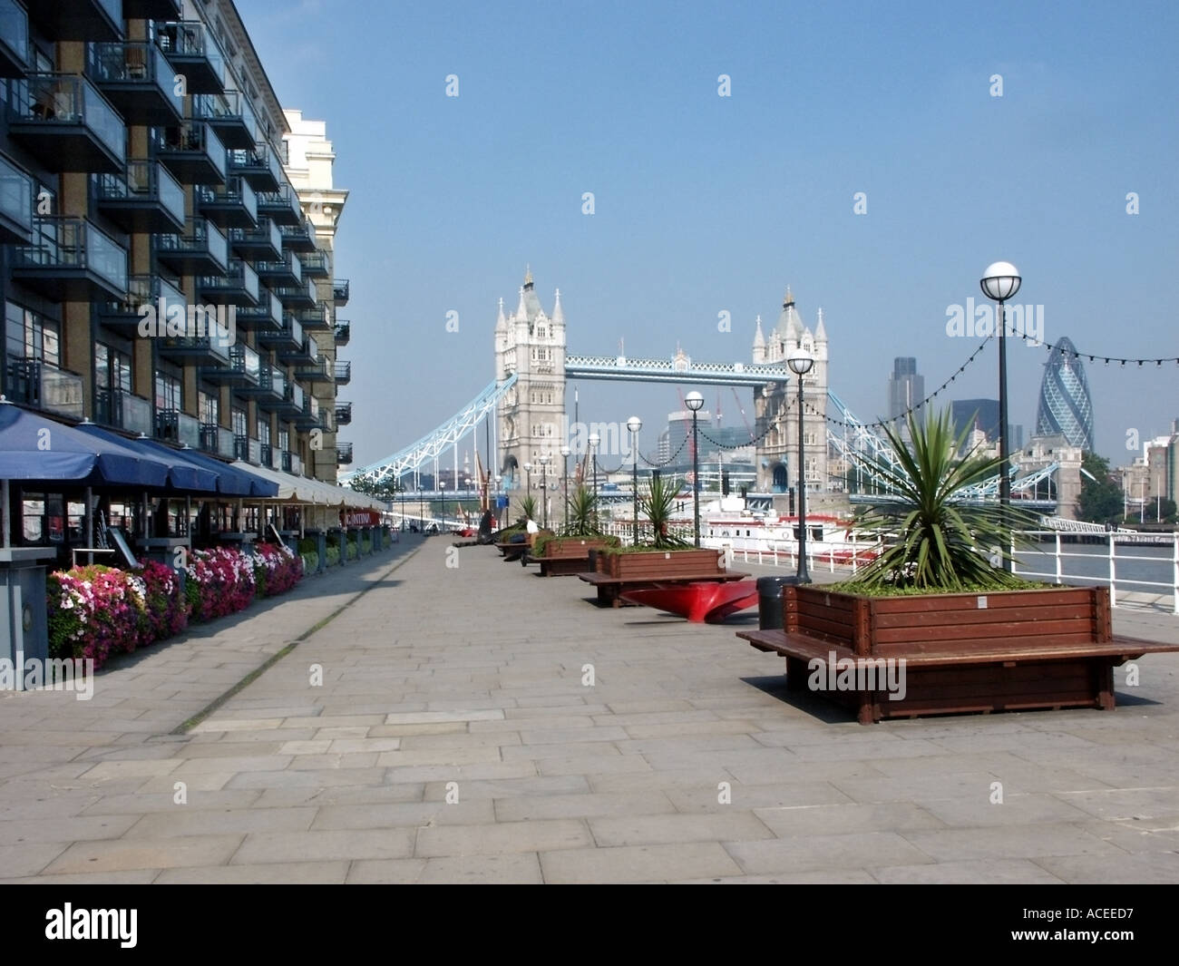 Thames riverside wide promenade close to Butlers Wharf with City of ...