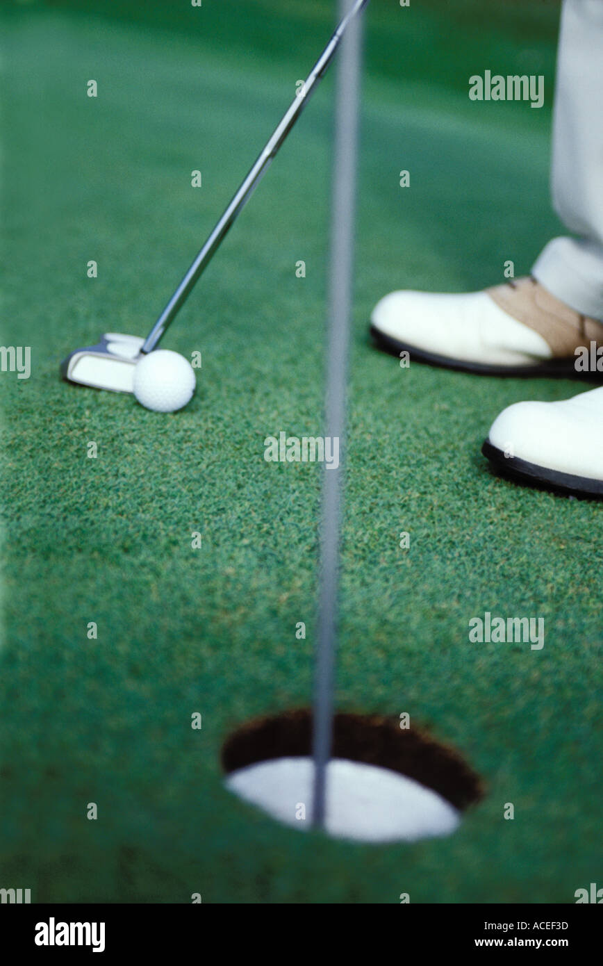 Golfer lining up putt hi-res stock photography and images - Alamy