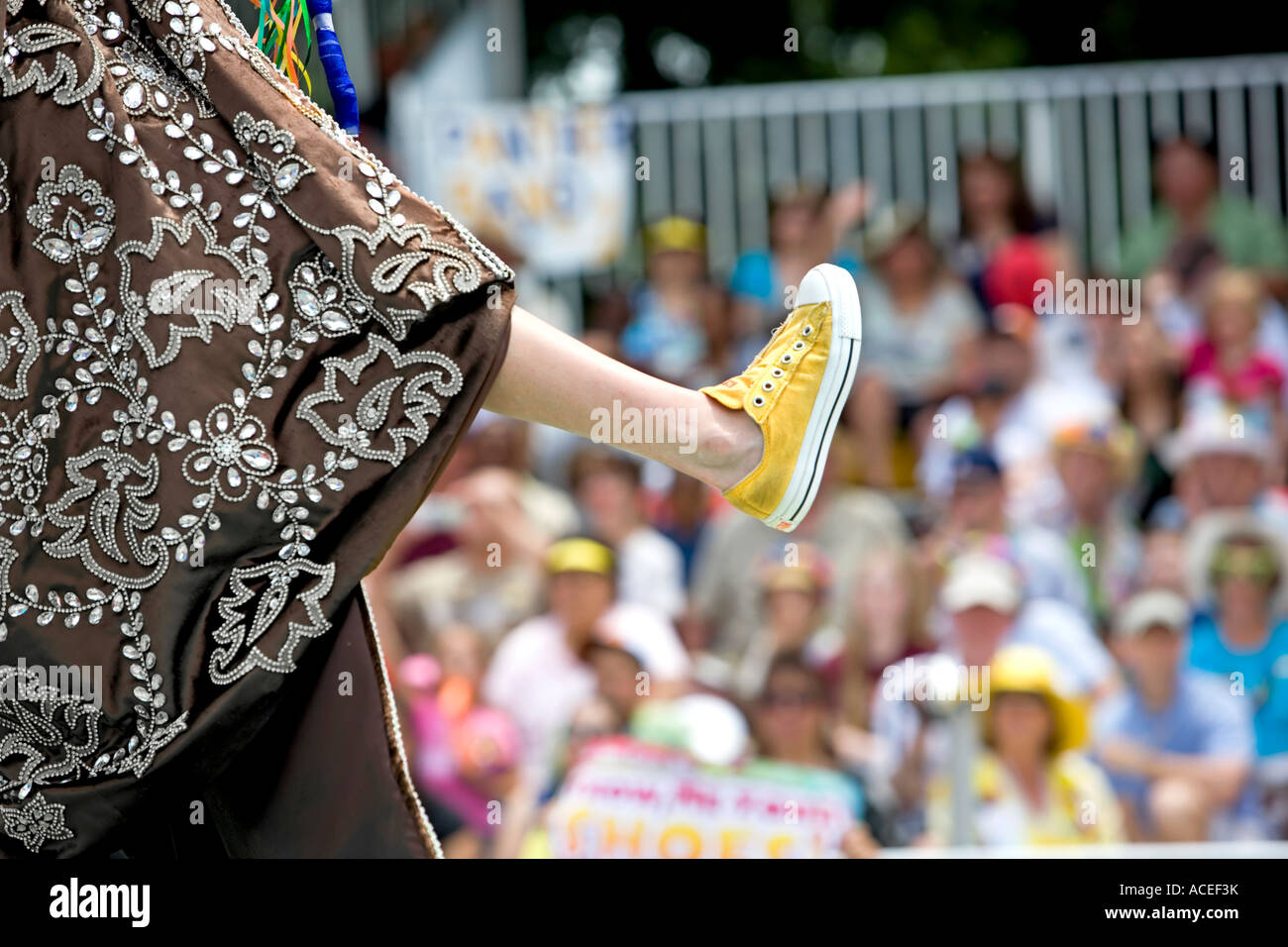 Fiesta Parade Queen with yellow tennis shoe Stock Photo - Alamy