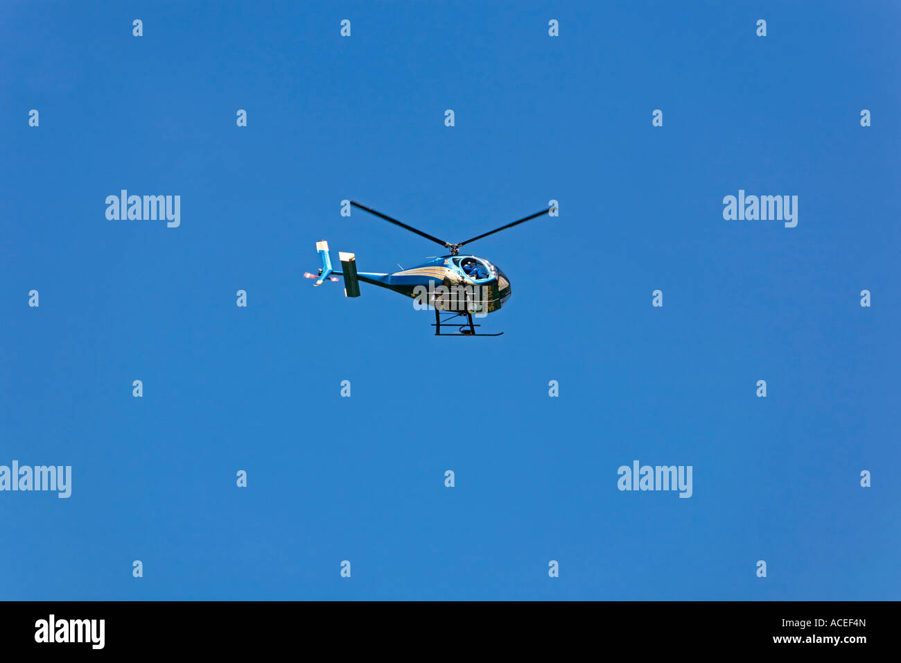 Helicopter police blue sky Stock Photo - Alamy