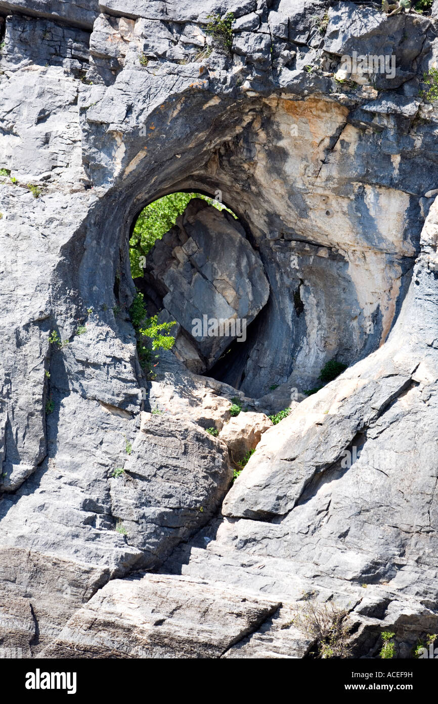 Rock in rock arch vertical stone arch Stock Photo - Alamy