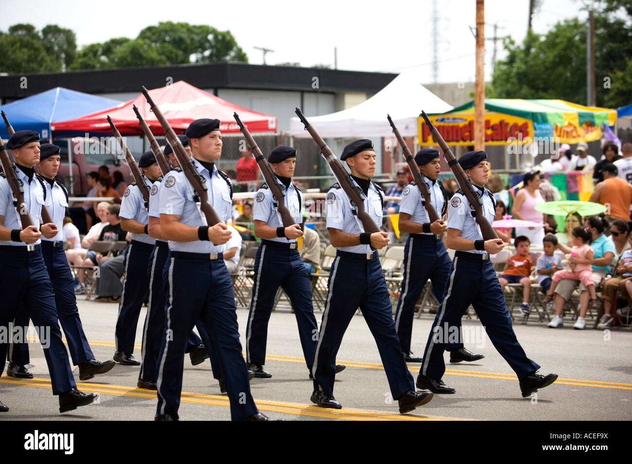 ROTC rifles on shoulder in Fiesta Parade in San Antonio Texas. Marching ...