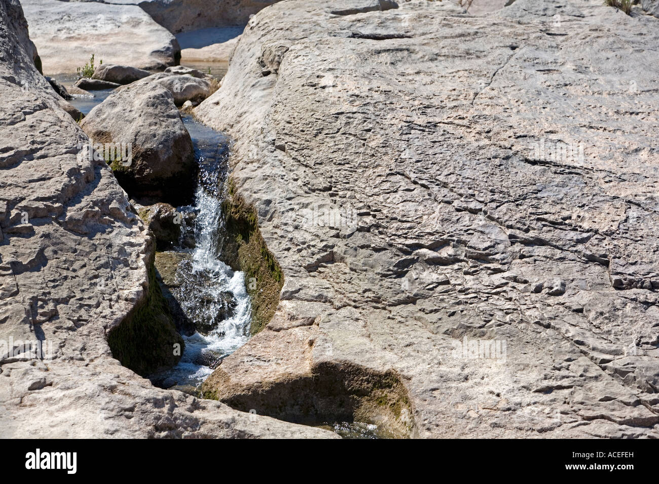 Waterfall through rocks Stock Photo - Alamy