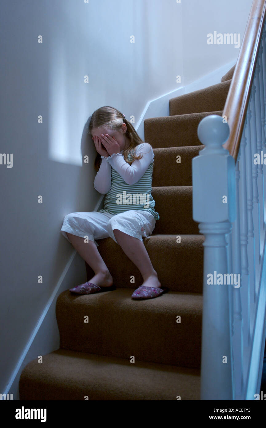 sad and lonely child on the stairs Stock Photo - Alamy
