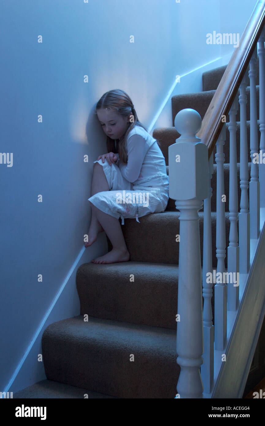 sad and lonely child on the stairs Stock Photo - Alamy