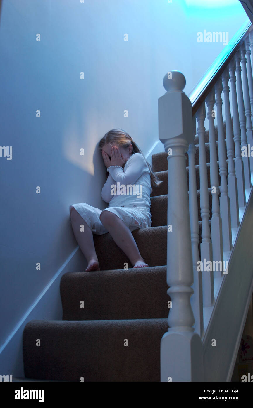 sad and lonely child on the stairs Stock Photo - Alamy
