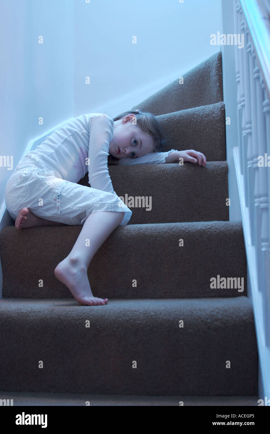 sad and lonely child on the stairs Stock Photo - Alamy