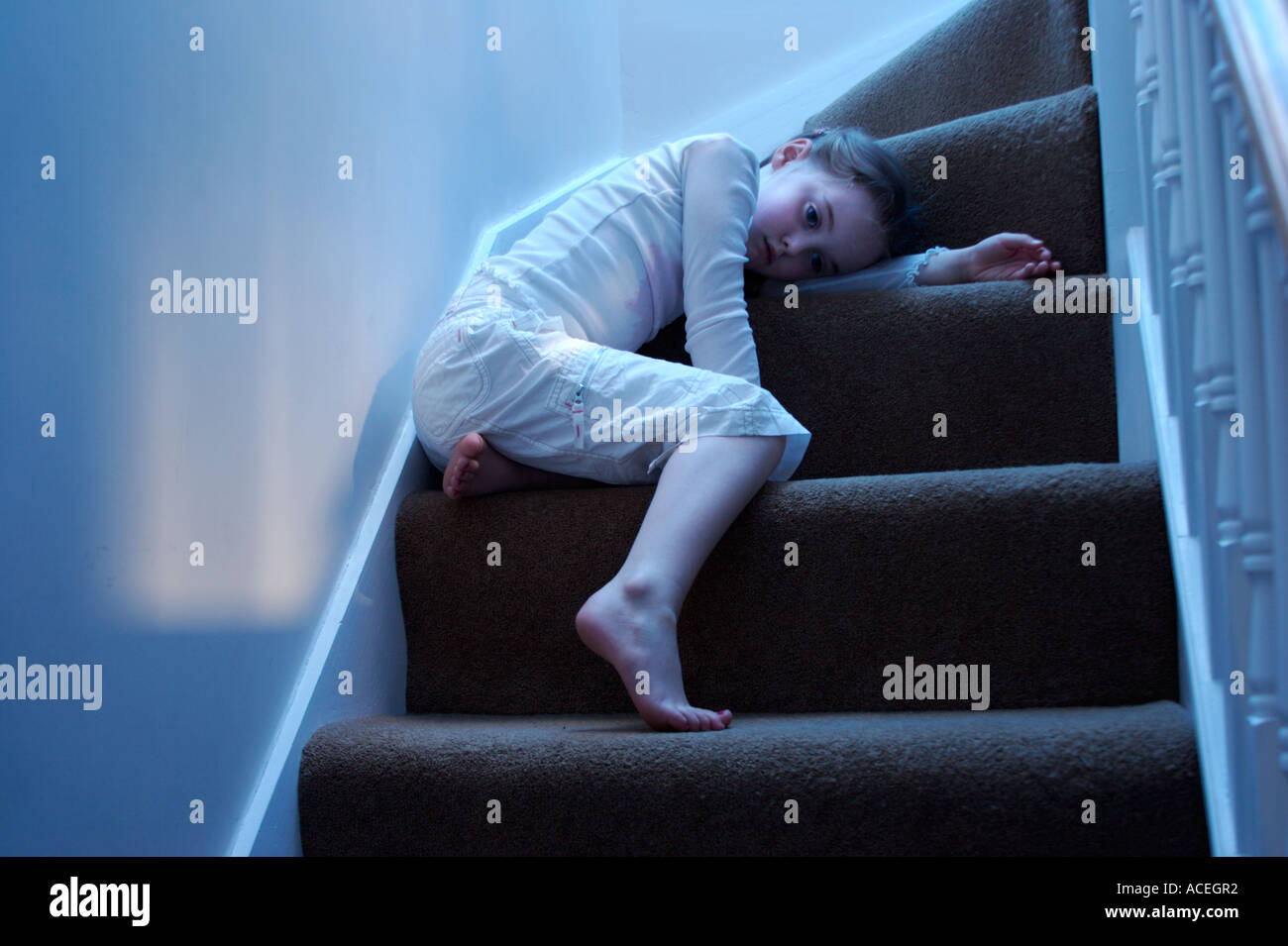 sad and lonely child on the stairs Stock Photo - Alamy