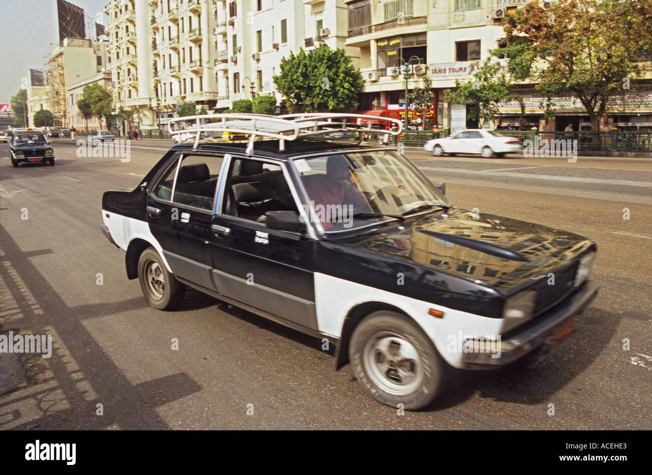 Cairo characteristic black and white taxis Stock Photo - Alamy