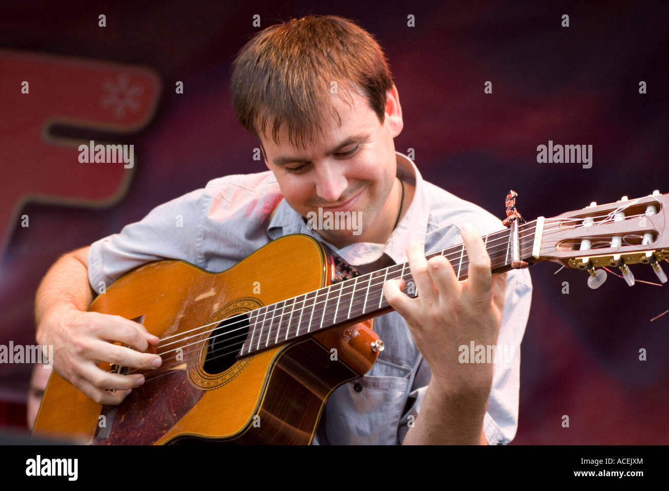 Man playing acoustic guitar at live open air concert Stock Photo - Alamy