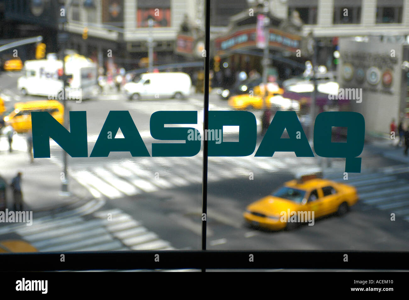 The Nasdaq logo appears on the windows of their headquarters in Times ...