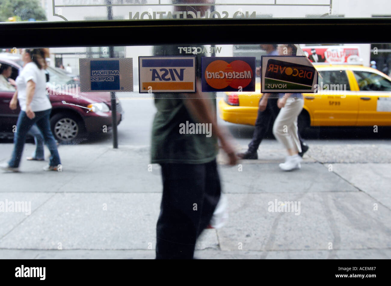 Stores advertising their acceptance of MasterCard Visa and American ...