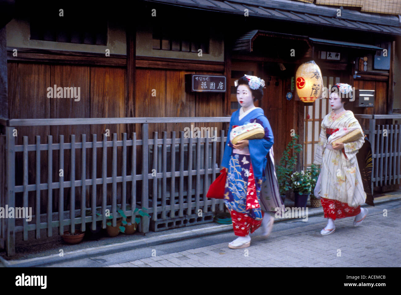 Two maiko wearing traditional kimono in Gion Hanamachi district of ...