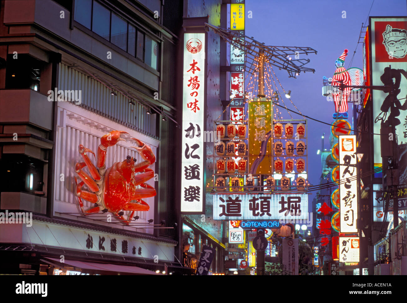 Neon signs light up the famous Dotonbori restaurant and entertainment ...