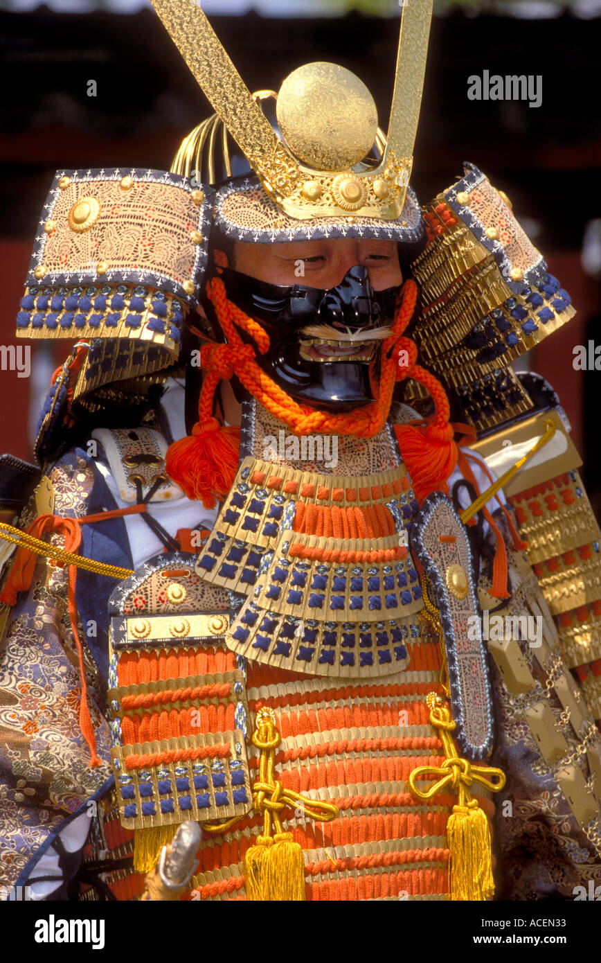 Man dressed in samurai warrior armor with kabuto helmet and face mask ...