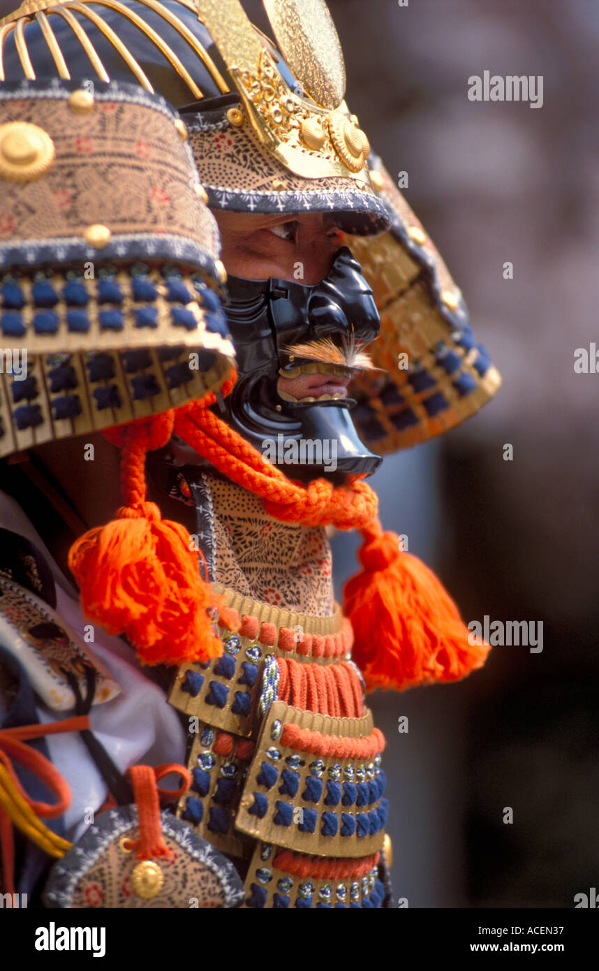 Man dressed in samurai warrior armor with kabuto helmet and face mask ...