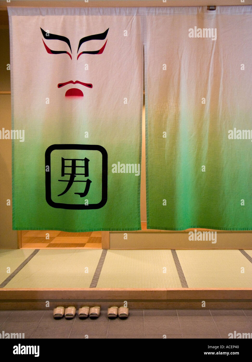 Kabuki face on noren curtain with kanji symbol for "men" hanging at ...