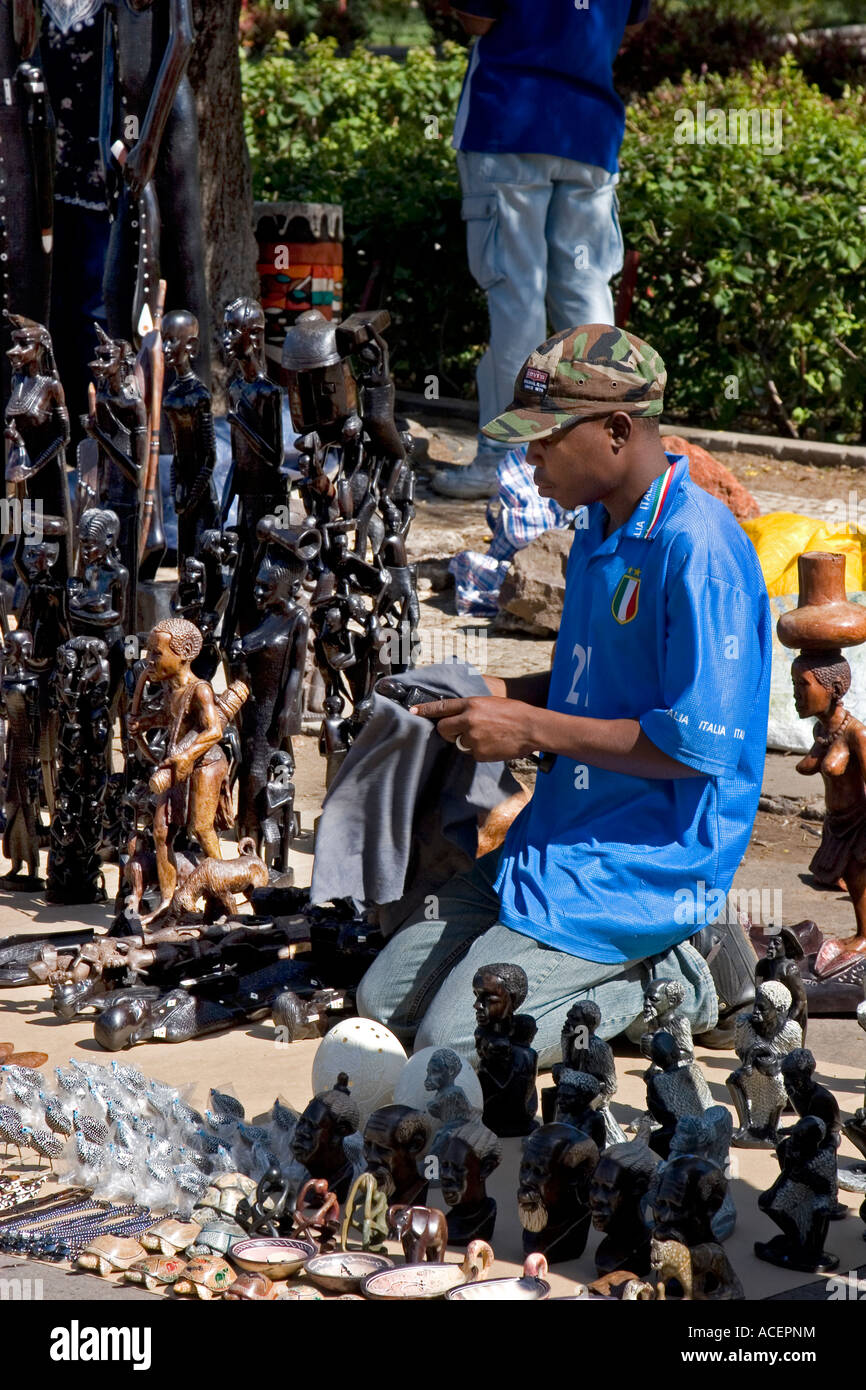 Vendor setting up his stall of woodcarvings, Saturday craft market ...