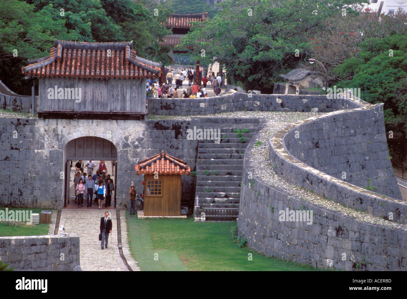 Visitors entering Shuri Castle in Naha Okinawa through Kankaimon Gate ...