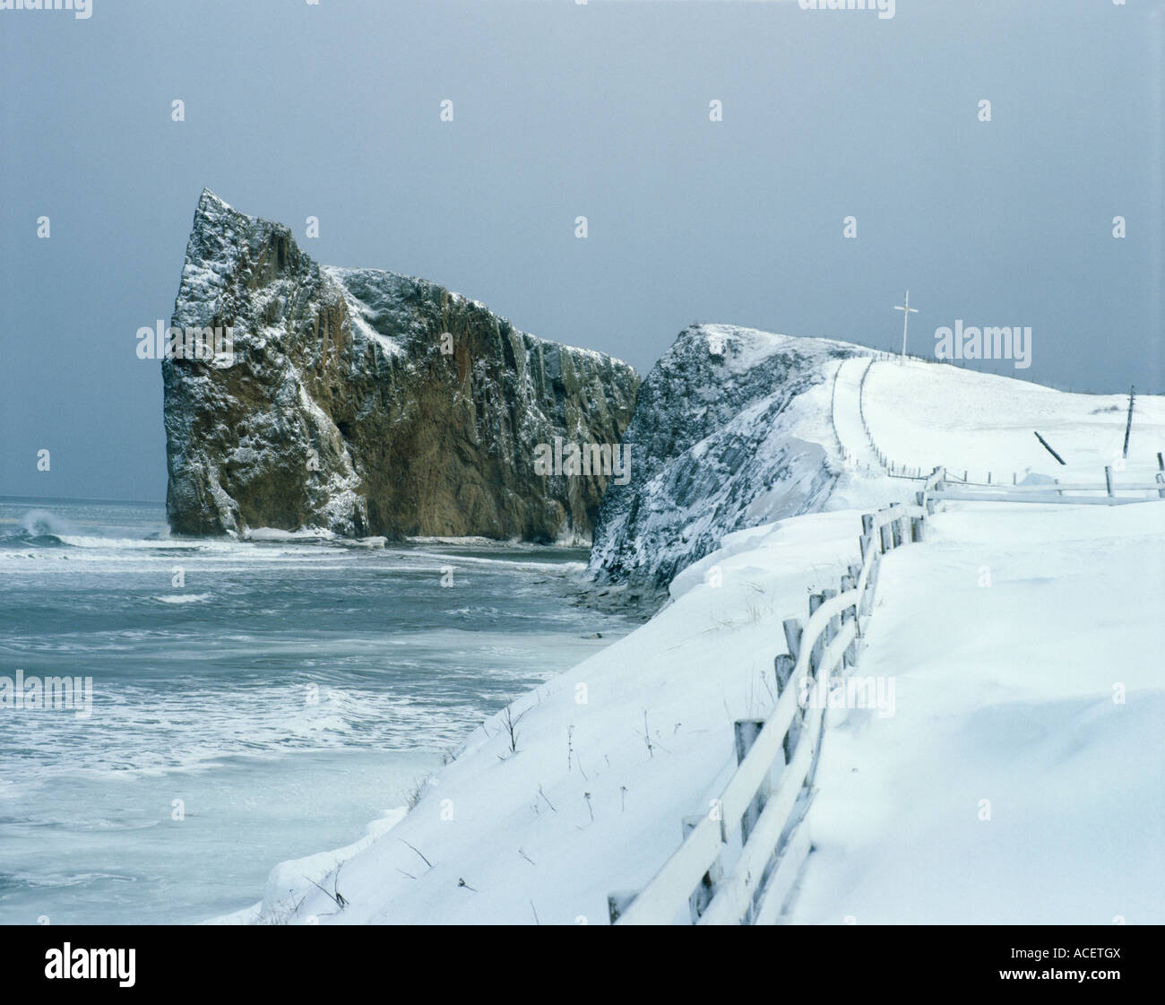 Huge Cliff on shoreline snow covered Stock Photo - Alamy