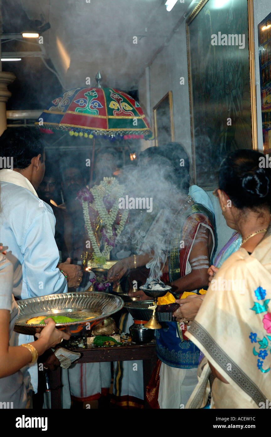 Indian women in sarees offering prayers Stock Photo - Alamy