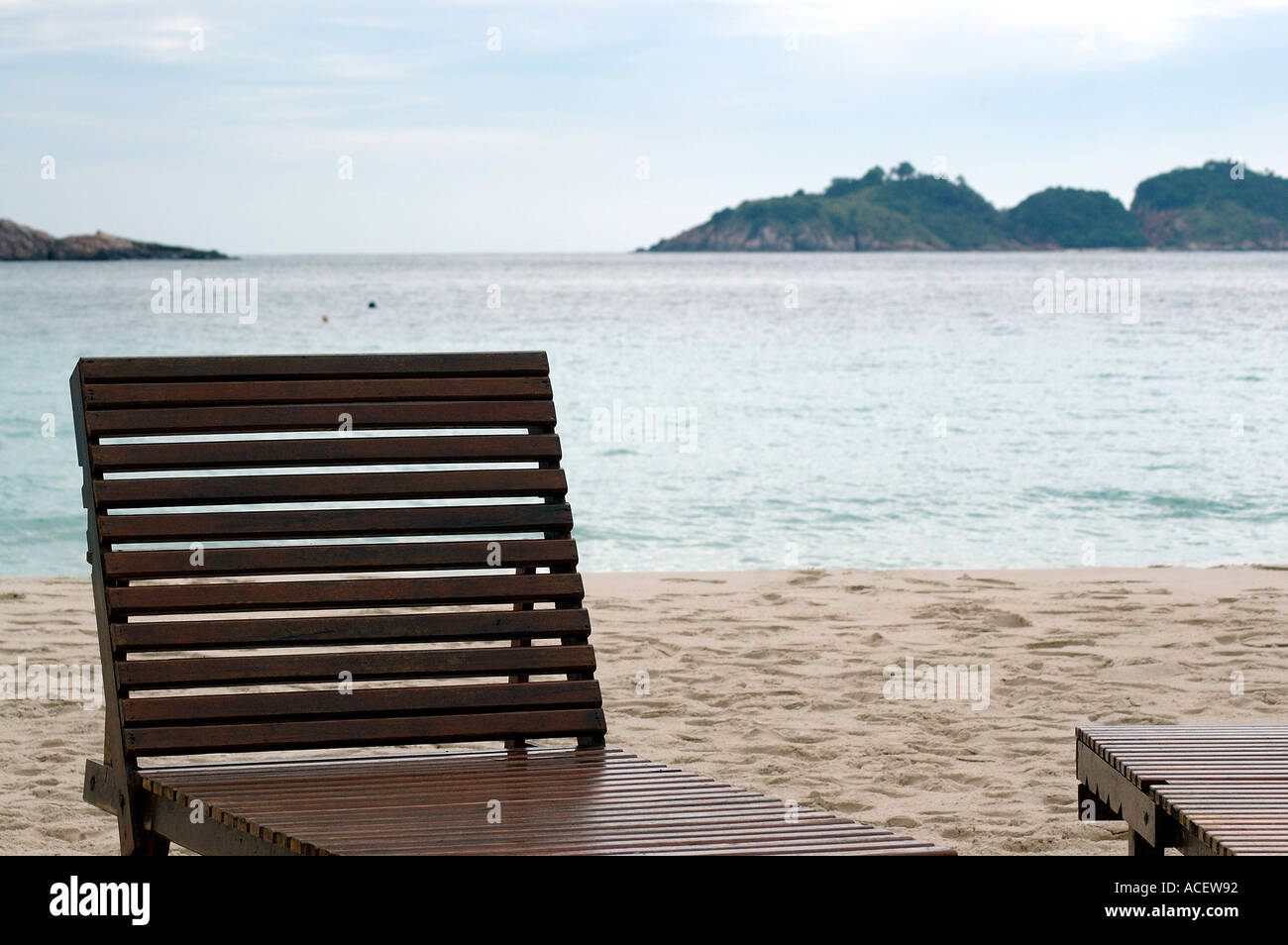 Sliding wooden bench by beach Stock Photo - Alamy