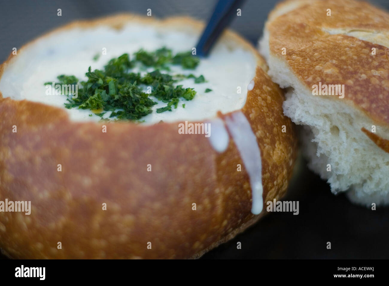 New England Clam Chowder in a sourdough bread bowl. Photographed in ...