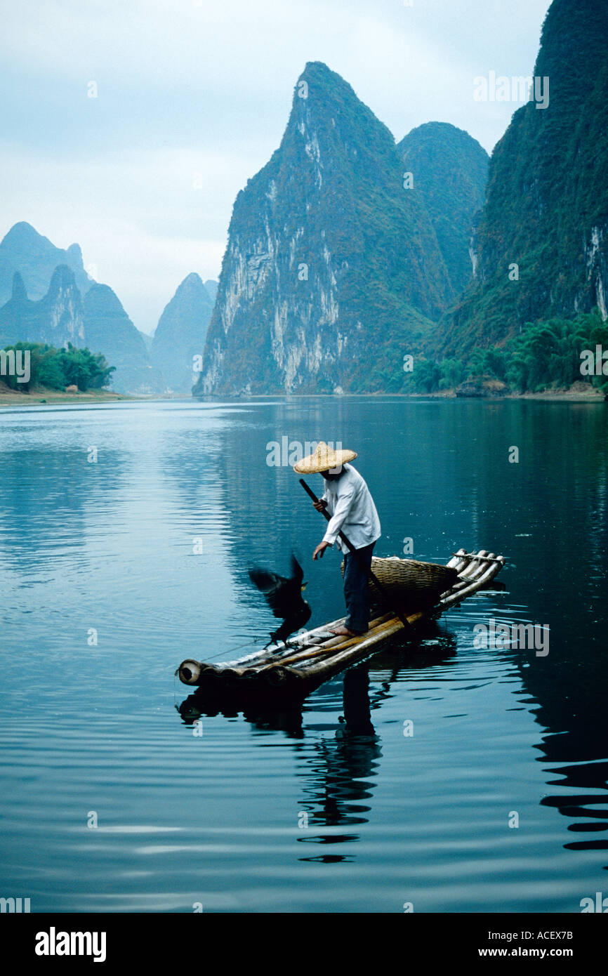 Li River, Guangxi, China: Cormorant fisherman on bamboo raft on river ...